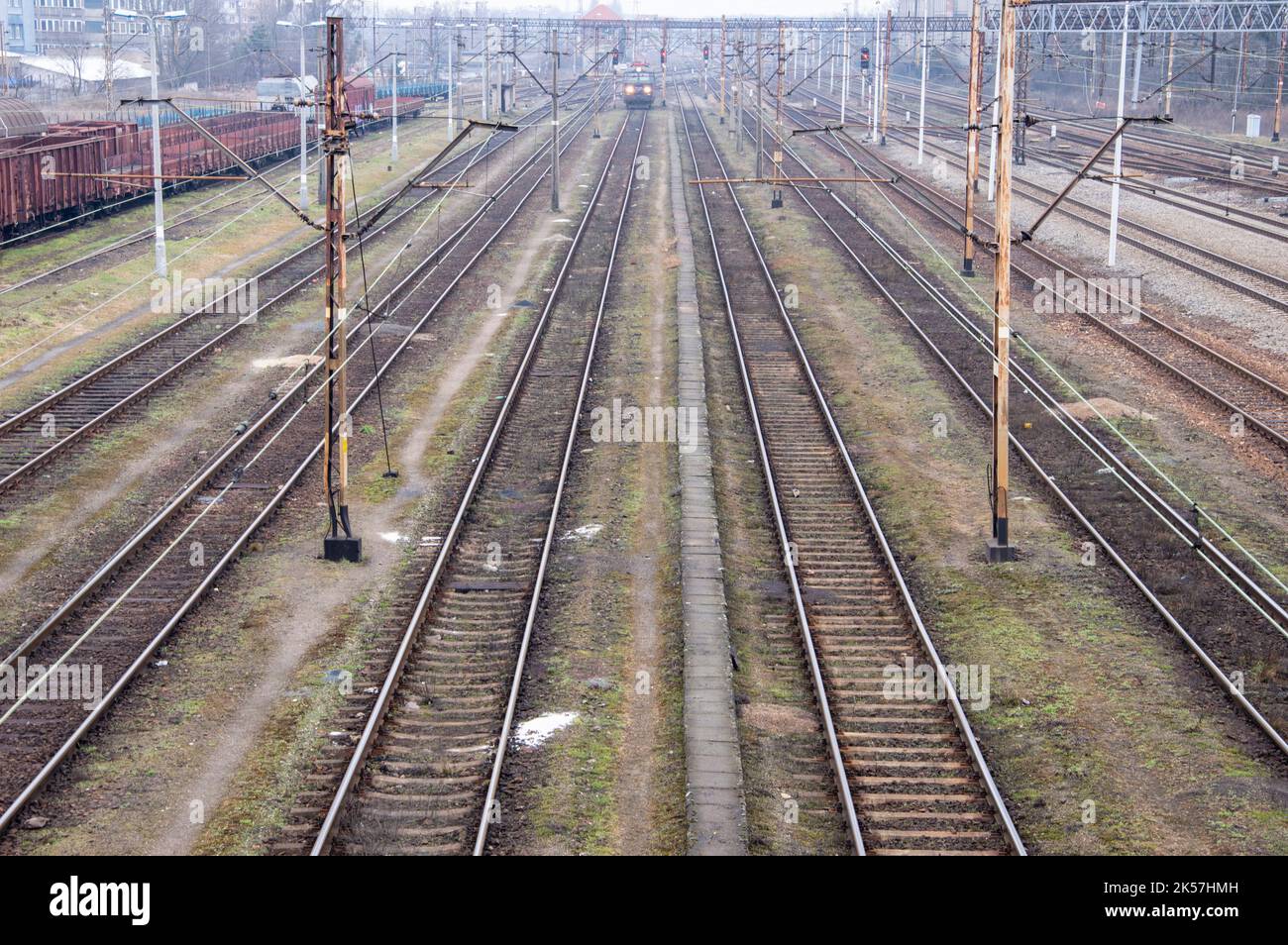 Railway infrastructure, tracks, rails and power cables over the tracks ...