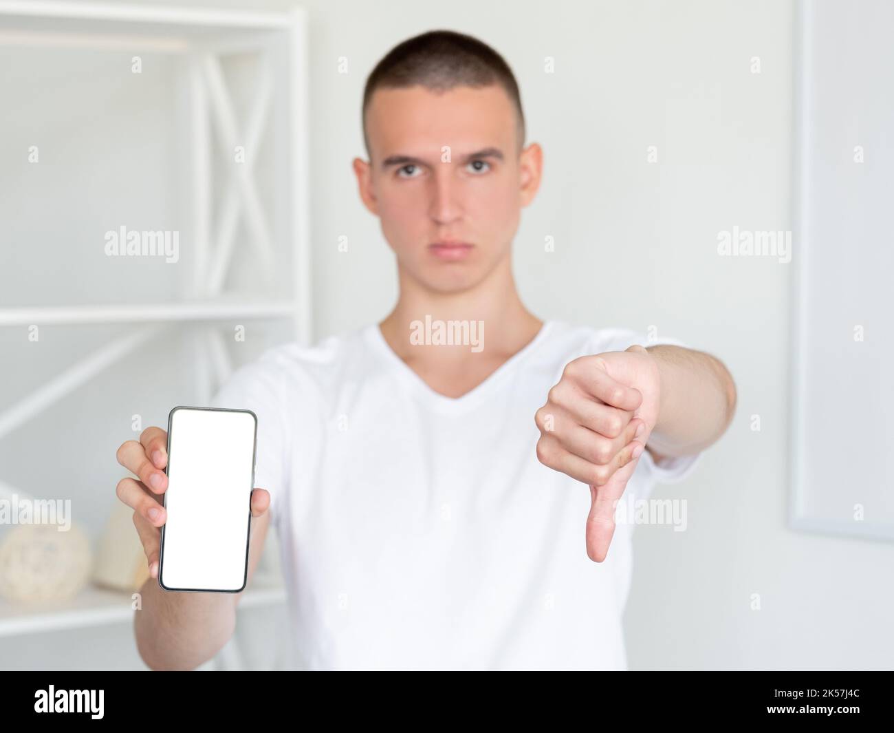 mobile internet displeased man dislike gesture Stock Photo - Alamy