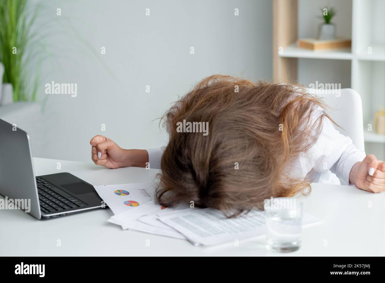 exhausted work office woman uninterested tasks Stock Photo - Alamy