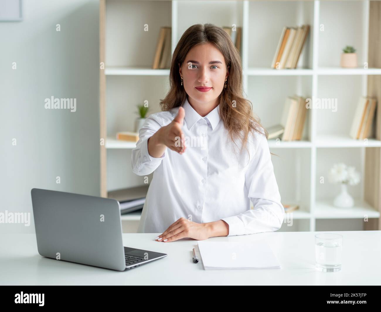 official meeting elegant woman welcome greeting Stock Photo - Alamy