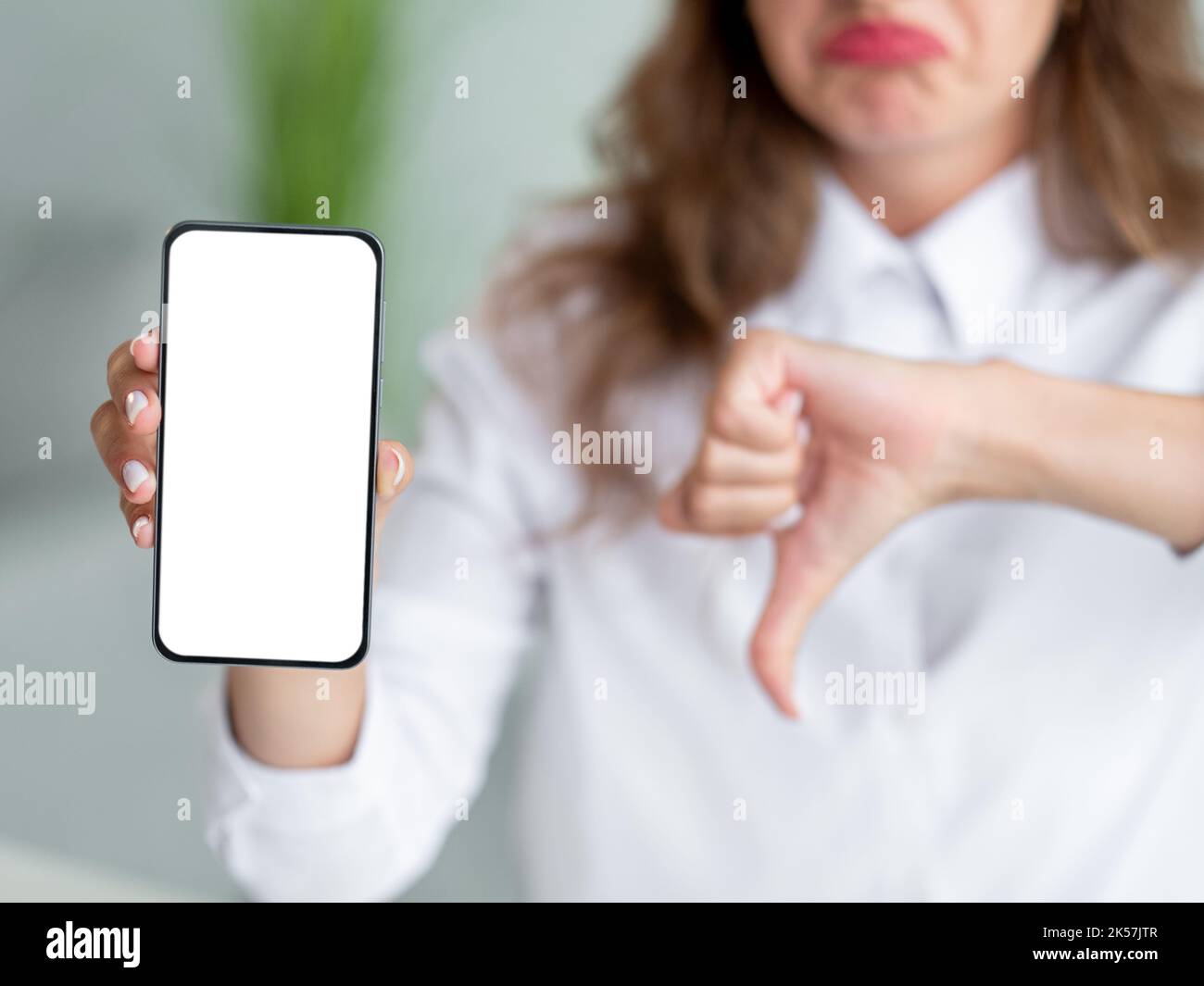 dislike gesture office woman mobile application Stock Photo - Alamy