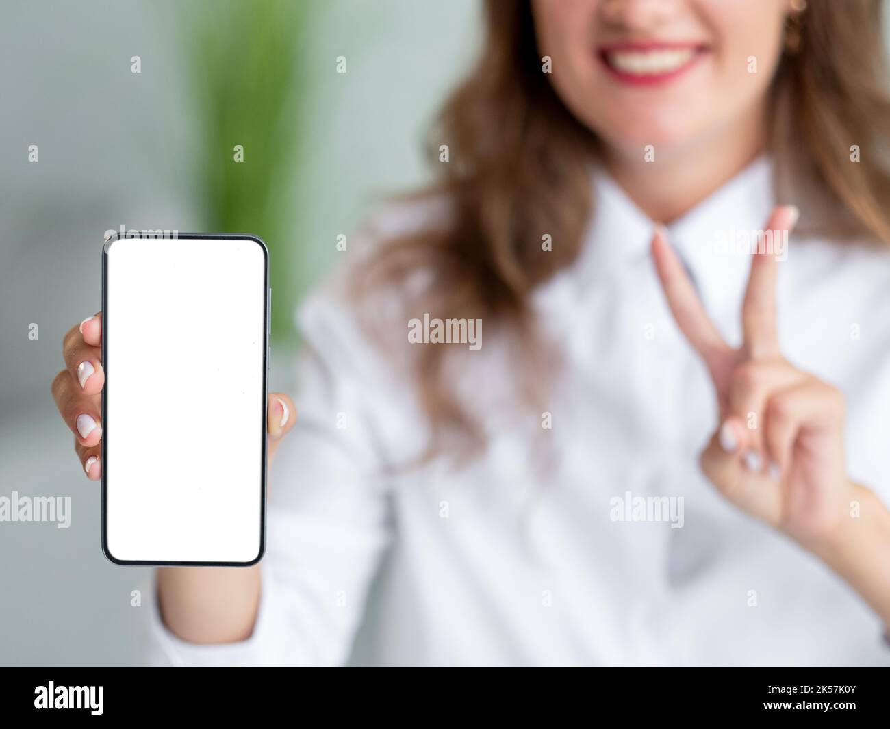 Woman showing by fingers hi-res stock photography and images - Alamy