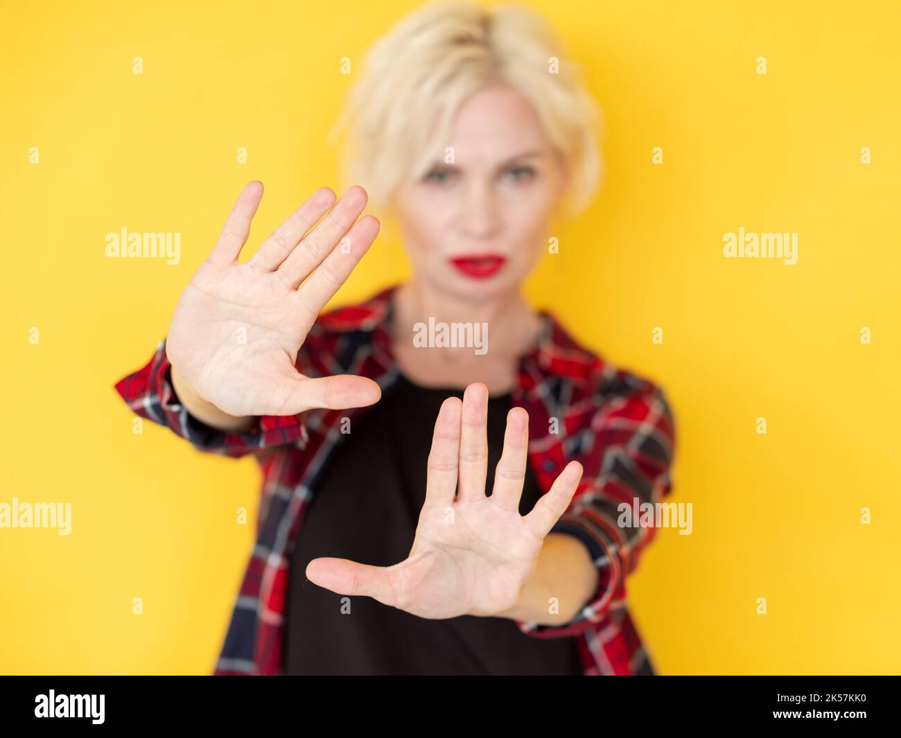 stay out refusal woman forbidden gesture defocused Stock Photo - Alamy