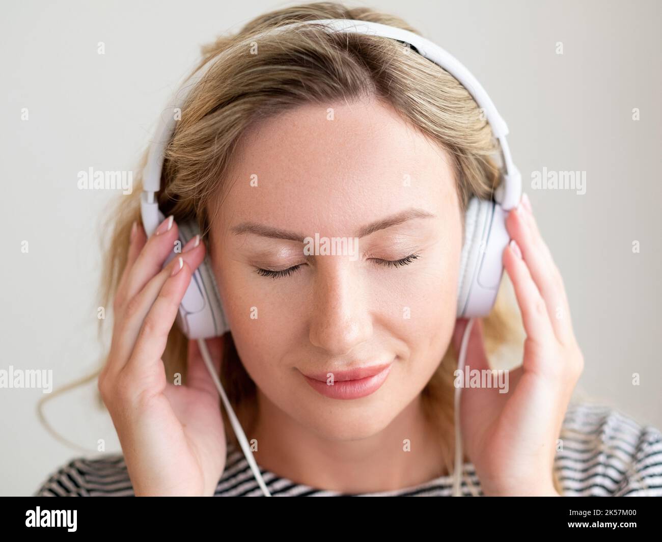 music relaxation inspired woman stereo sound Stock Photo - Alamy