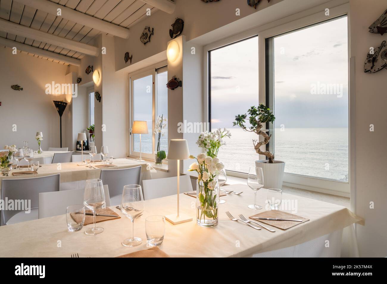 Interior of an elegant Italian restaurant with sea view Stock Photo - Alamy