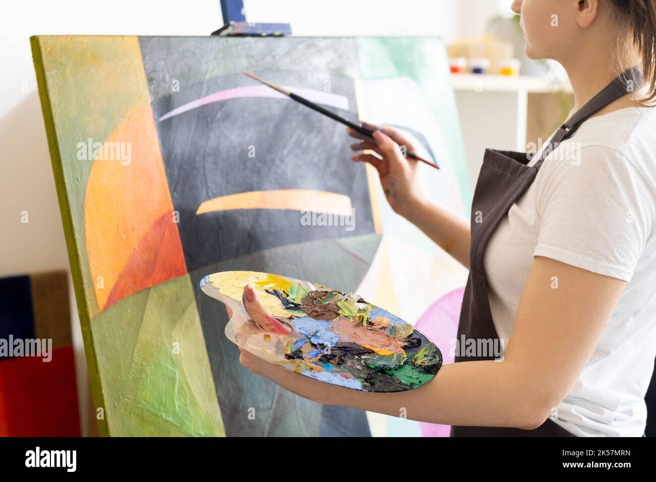 Painting process. Abstract picture. Art school. Unrecognizable woman ...