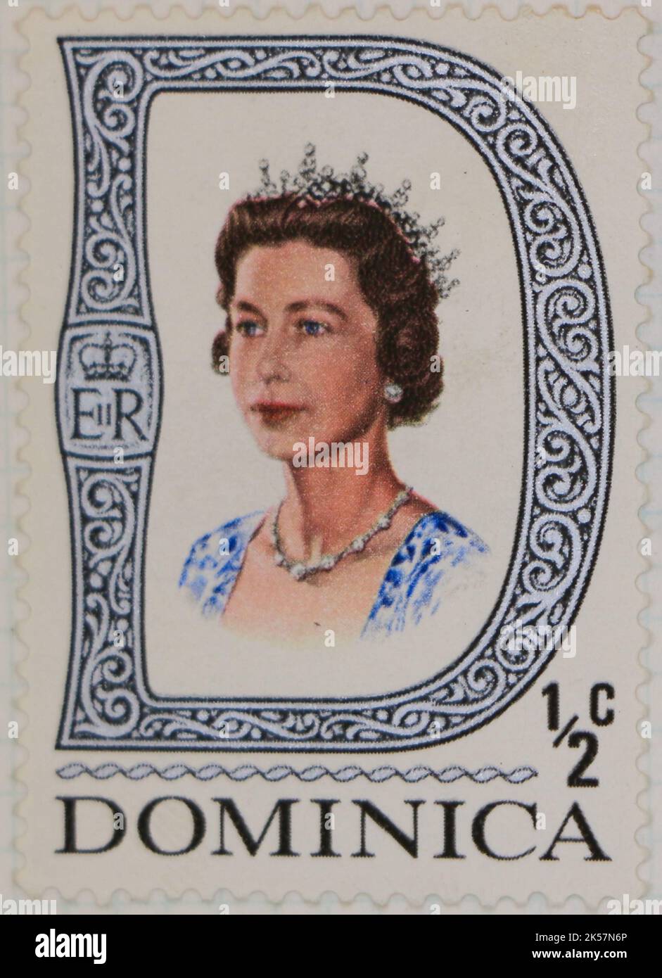 Photo of a Dominica postage stamp with a large silver D surrounding a ...
