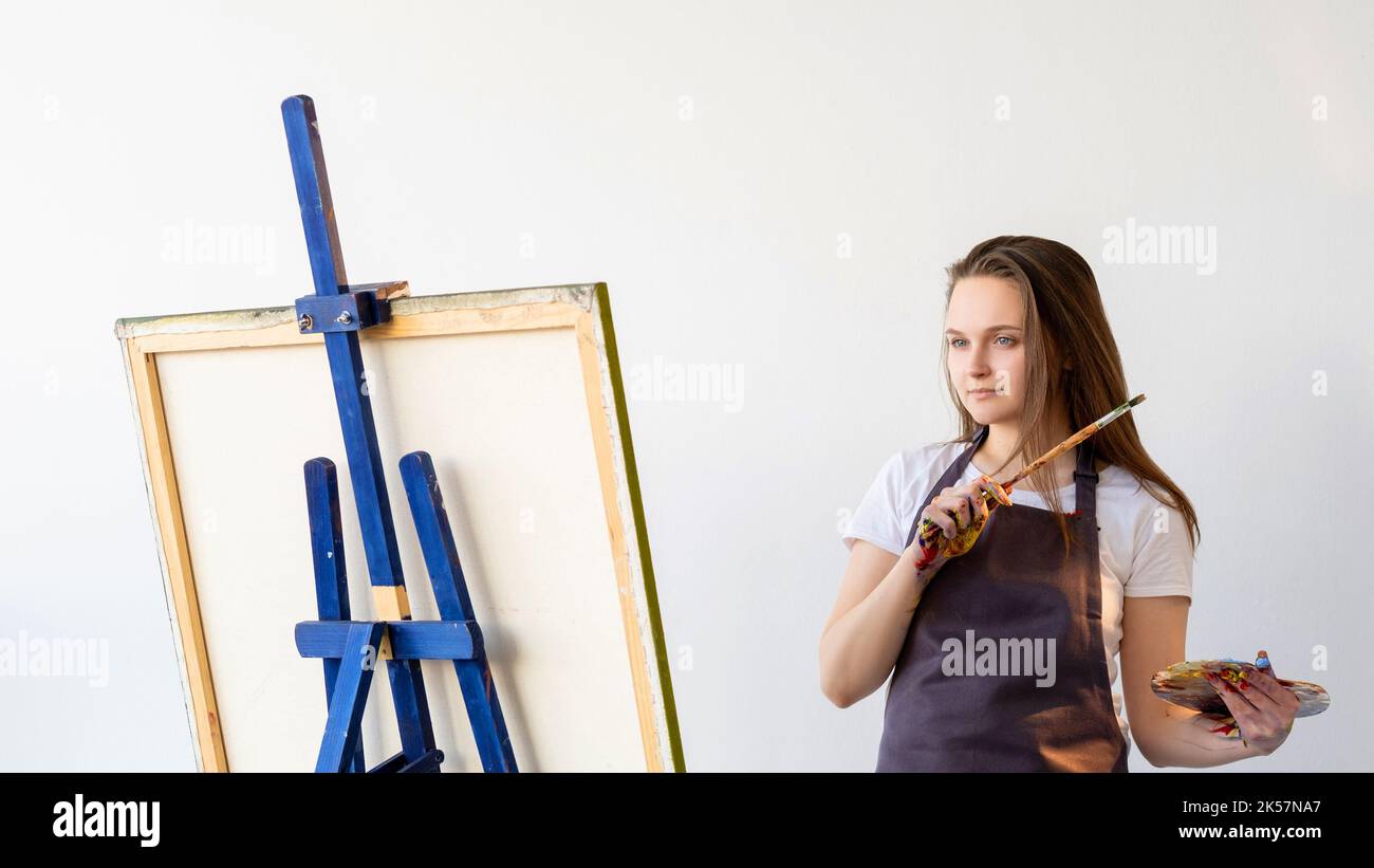 Inspired female artist. Creating picture. Painting school. Master class ...