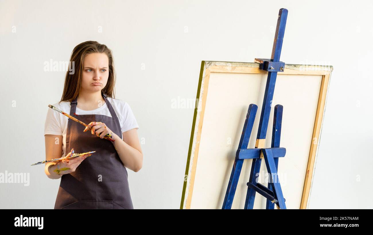 Bad result. Female artist. Creating process. Muse inspiration. Unsatisfied skeptic woman with ...