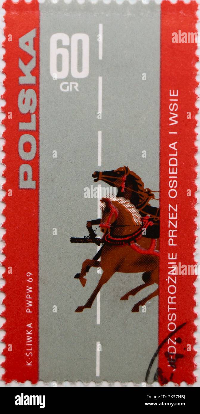 Photo of a Polish postage stamp with an image of horses crossing a road ...