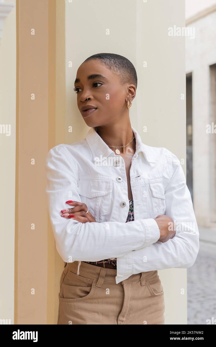 Short haired african american woman posing on urban street in Treviso ...