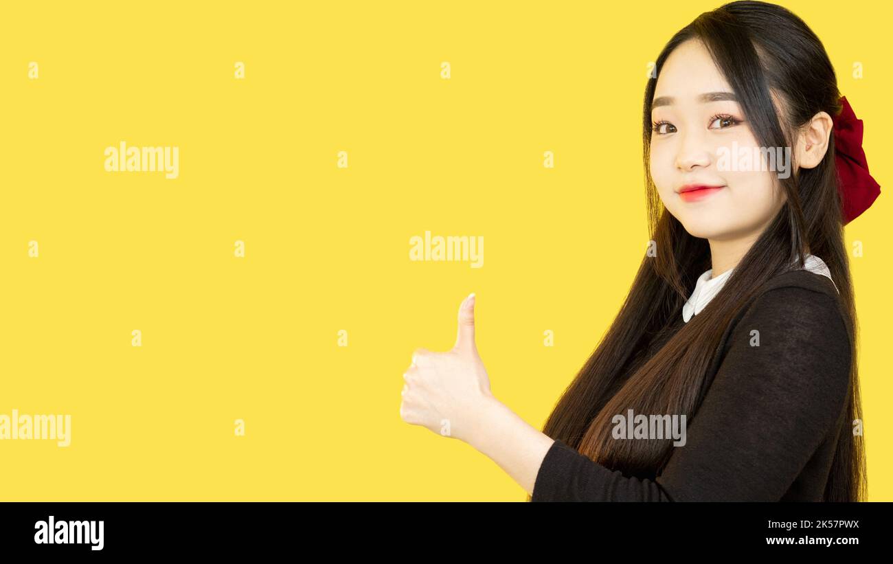thumbs up agreement sign woman like gesture promo Stock Photo - Alamy