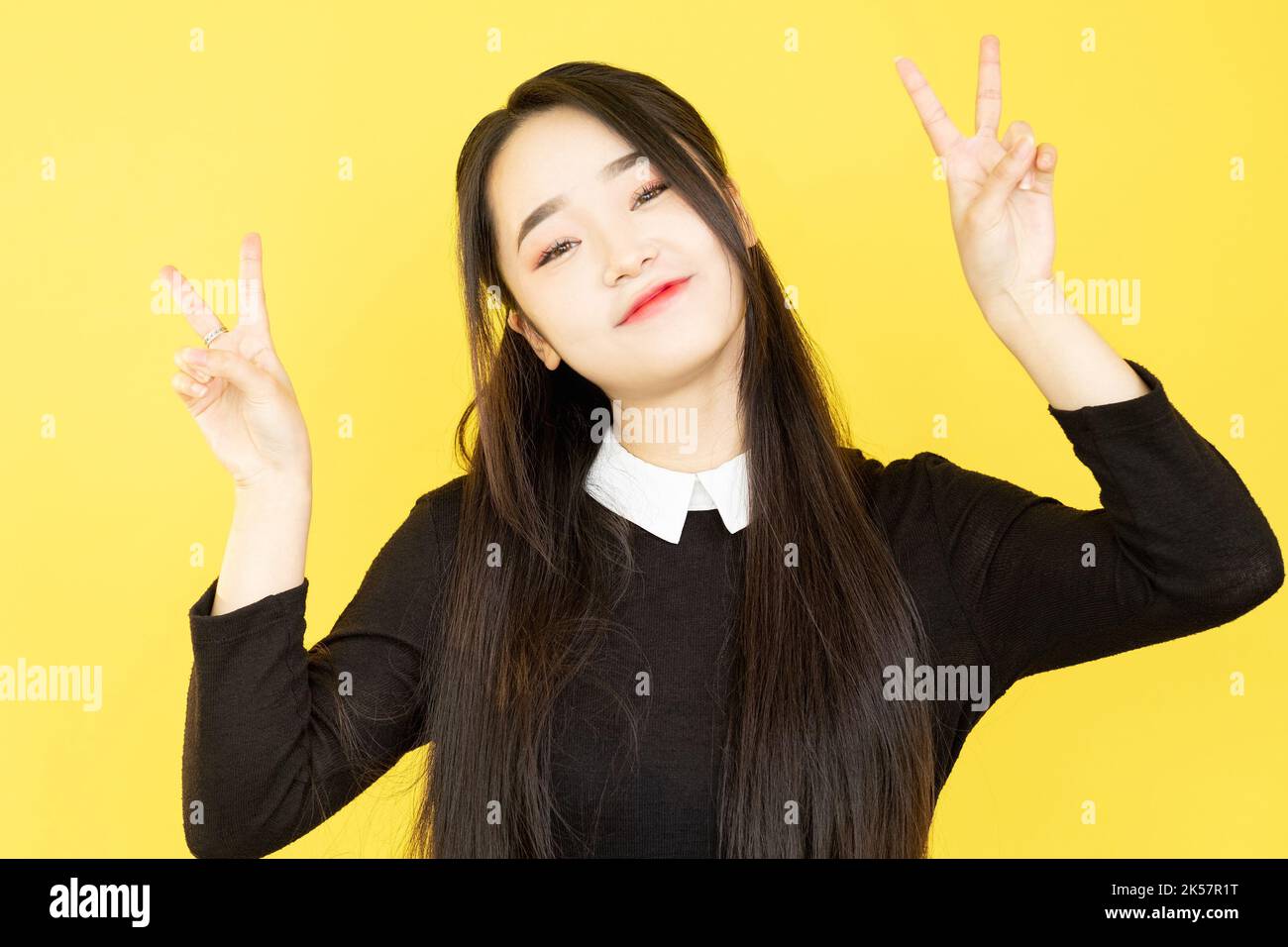 Excited woman showing victory sign hi-res stock photography and images ...