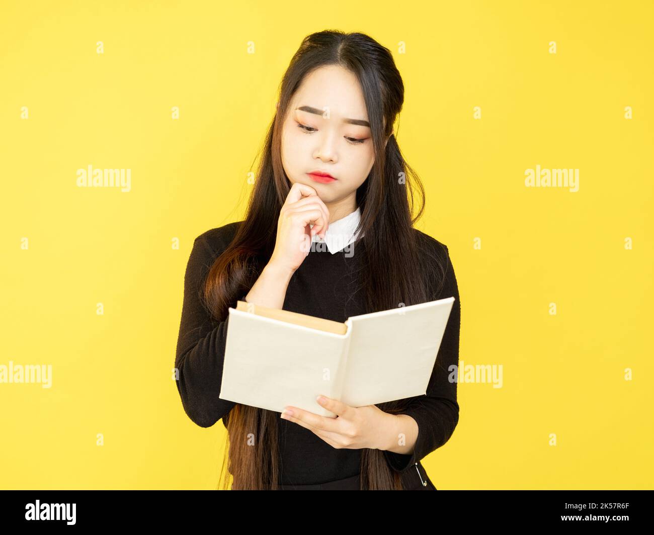 smart student book reading clever thinking girl Stock Photo - Alamy