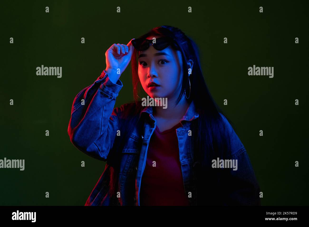 surprised woman neon light people shocked girl Stock Photo - Alamy