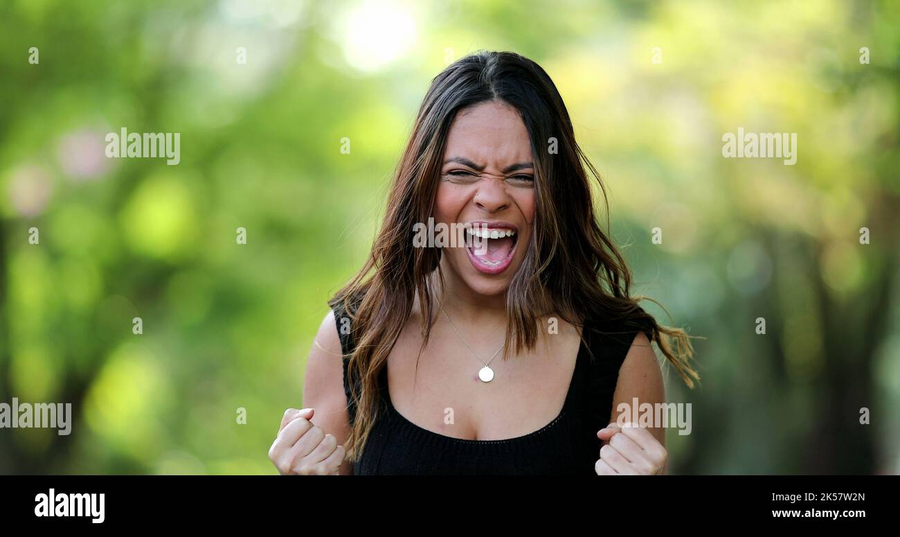 Funny angry hispanic woman yelling at camera, confused frustrated ...