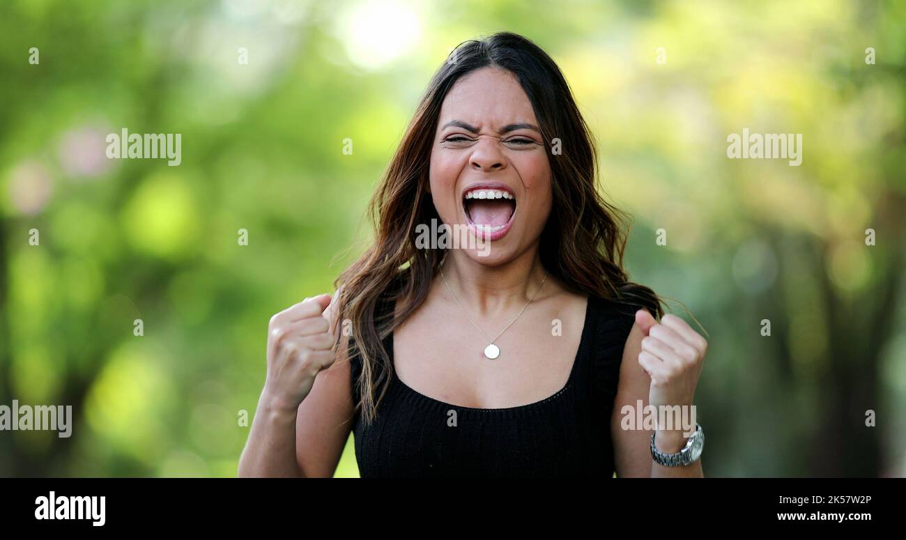Funny angry hispanic woman yelling at camera, confused frustrated ...