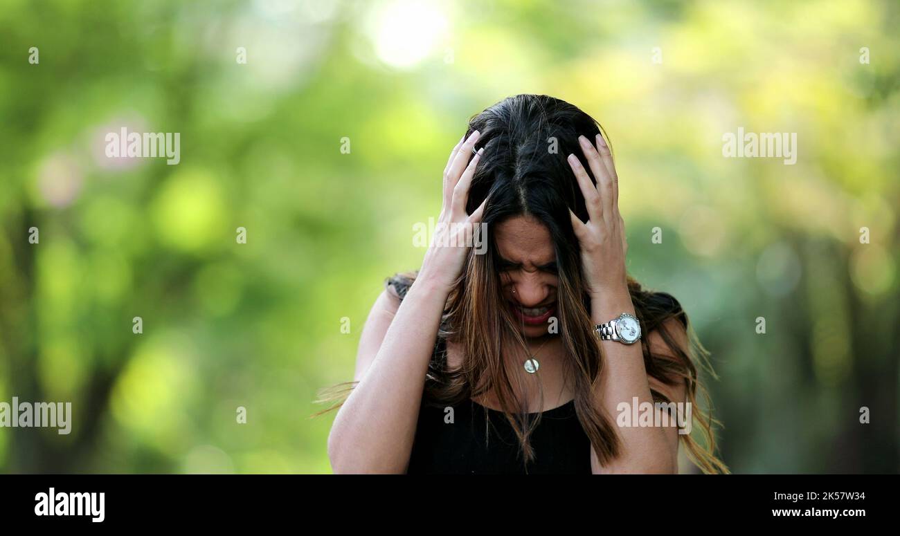 Funny angry hispanic woman yelling at camera, confused frustrated ...