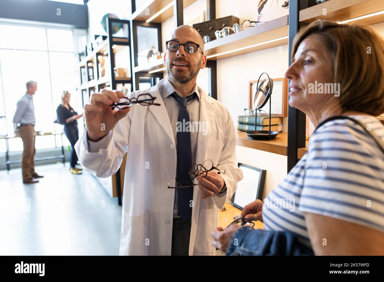 Optical store talking hi-res stock photography and images - Alamy