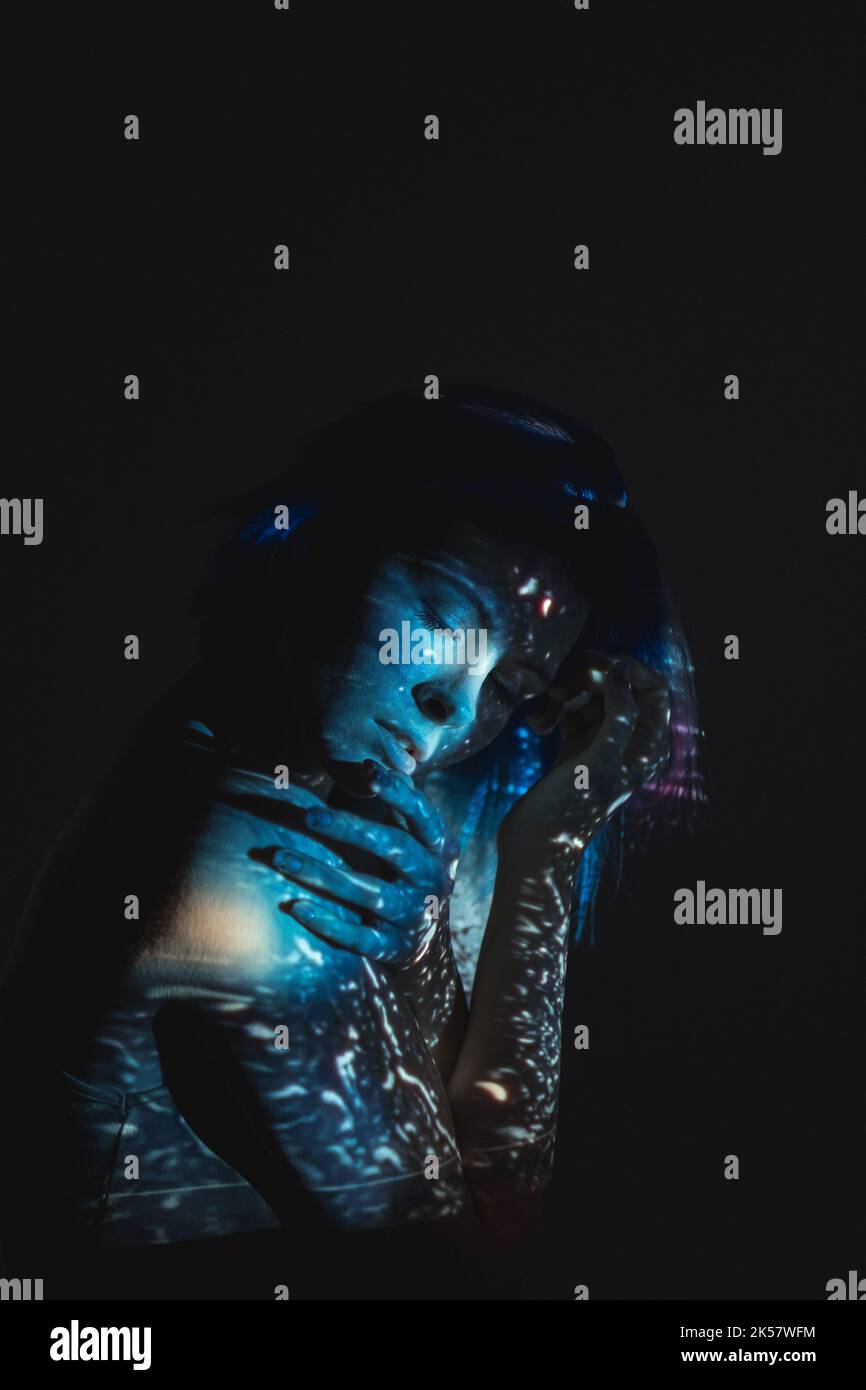 art portrait night loneliness woman in blue light Stock Photo - Alamy