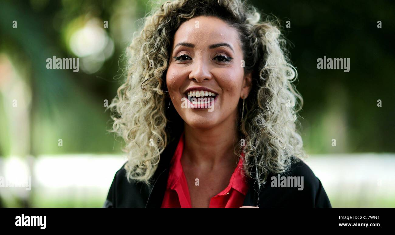 Happy hispanic woman laughing outside. Casual latin person, south ...