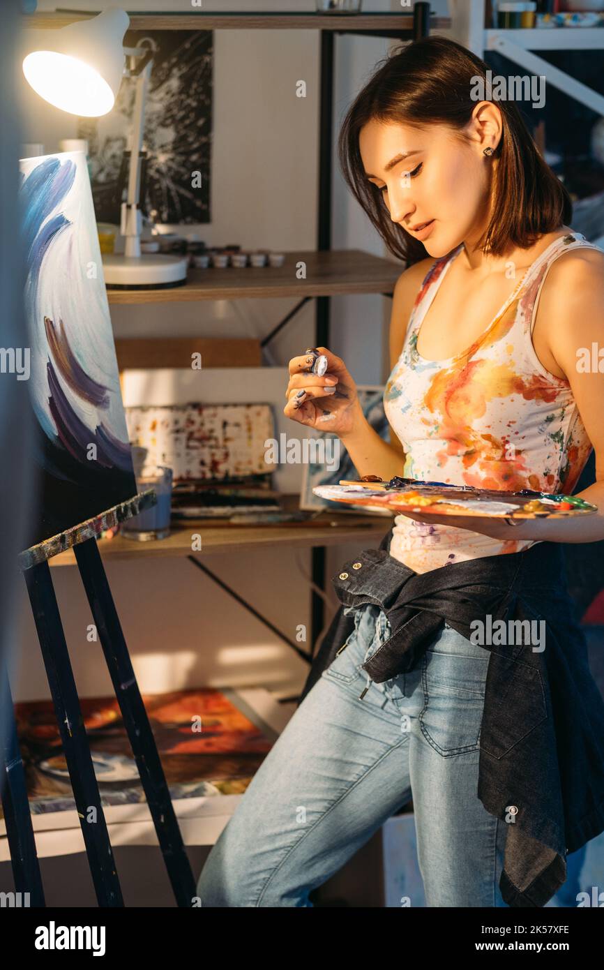 painting craft visual art female artist in studio Stock Photo - Alamy
