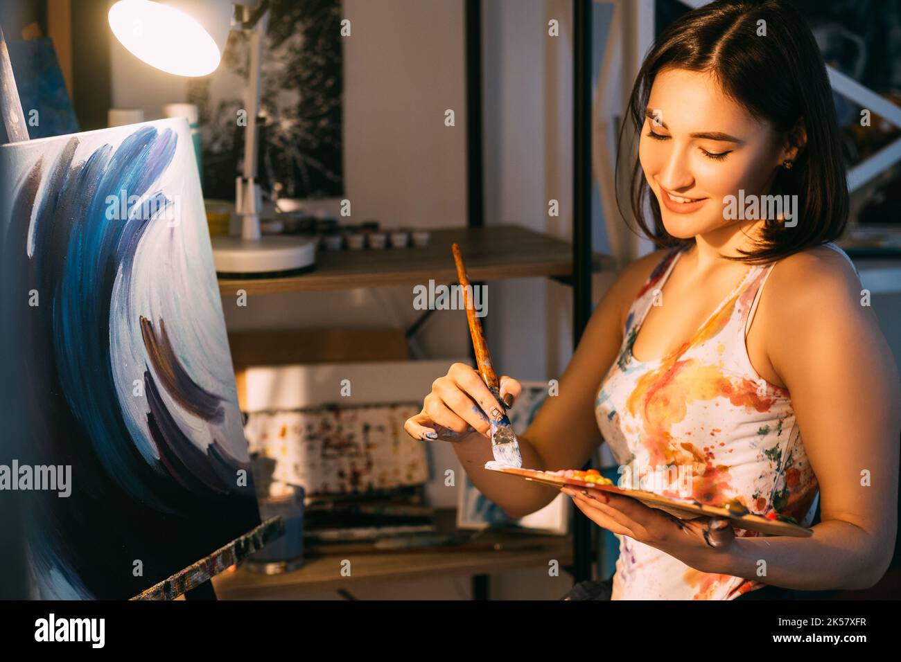 art therapy painting hobby happy artist in studio Stock Photo - Alamy