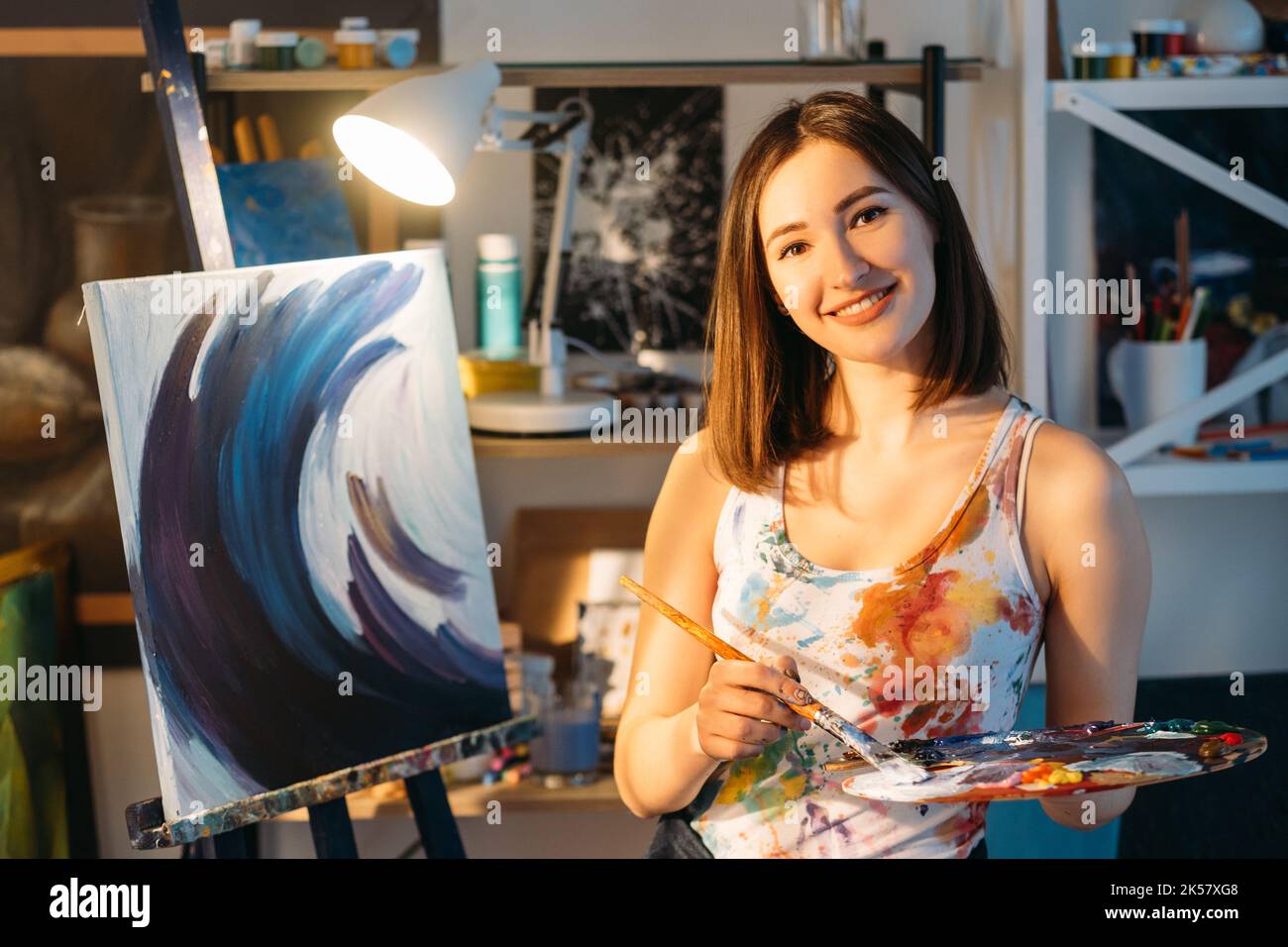 painting hobby happy female artist in workshop Stock Photo - Alamy