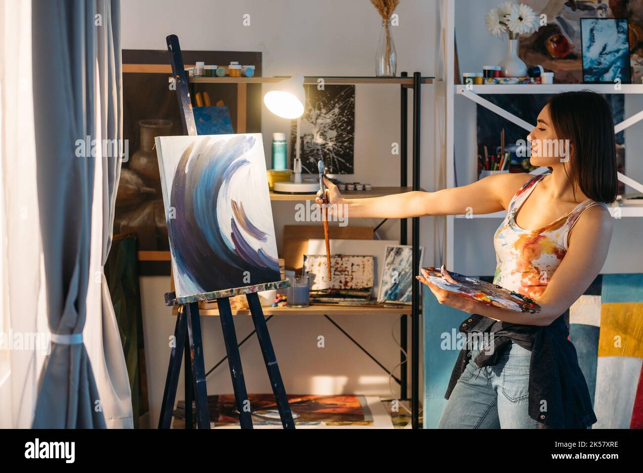 visual art professional painting artist in studio Stock Photo - Alamy