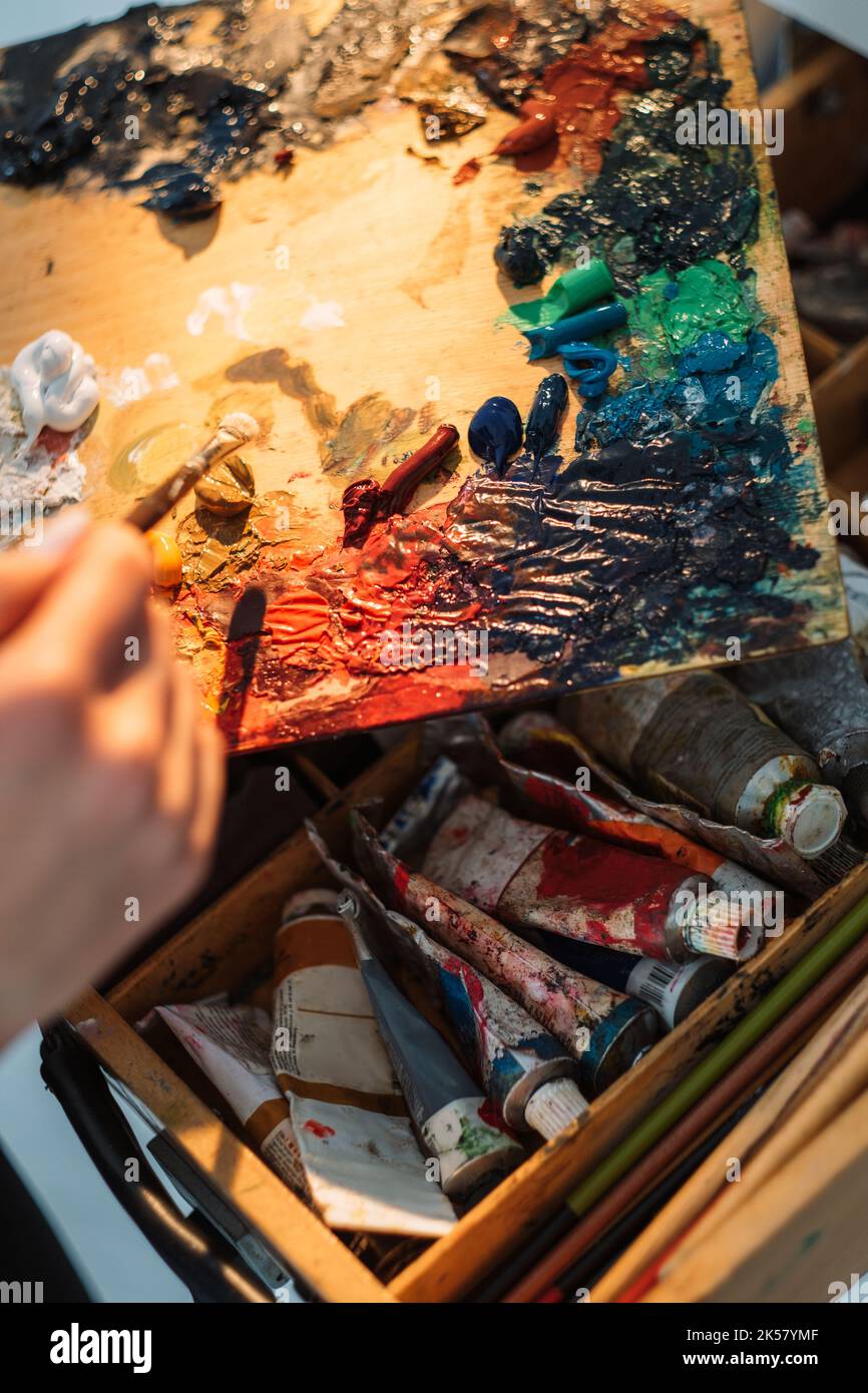 painting hobby art process hand paint on palette Stock Photo - Alamy