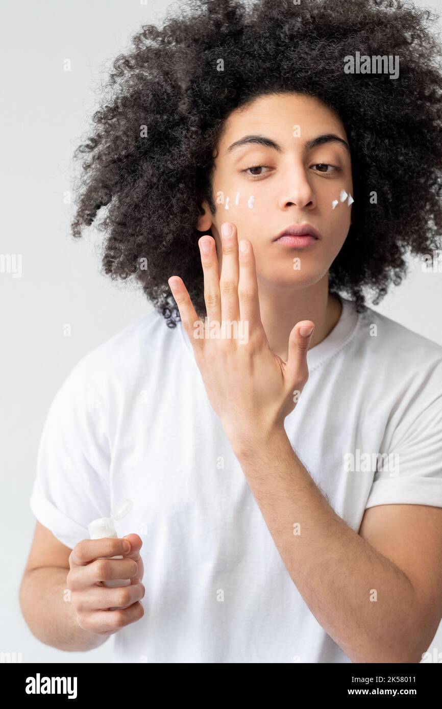 Male skincare. Face moisturizing. Cosmetic product. Confident handsome ...