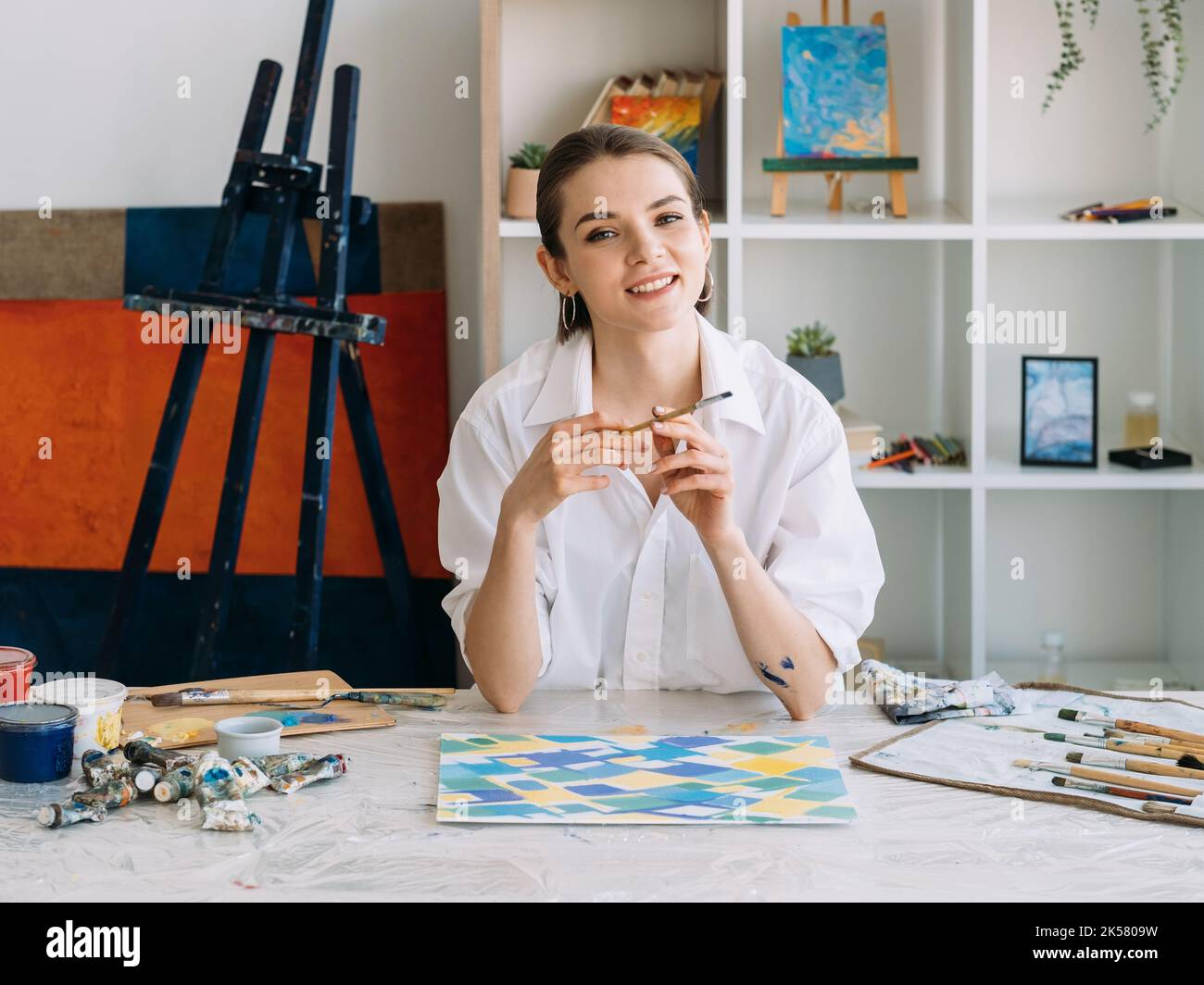 art class painting skill smiling artist in studio Stock Photo - Alamy