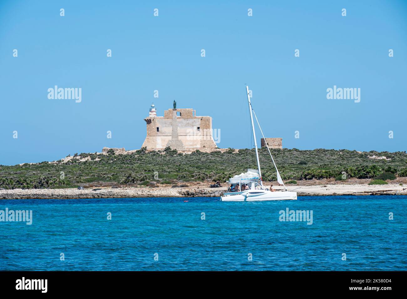 The island of Capo Passero in front of Portopalo where the waters of ...