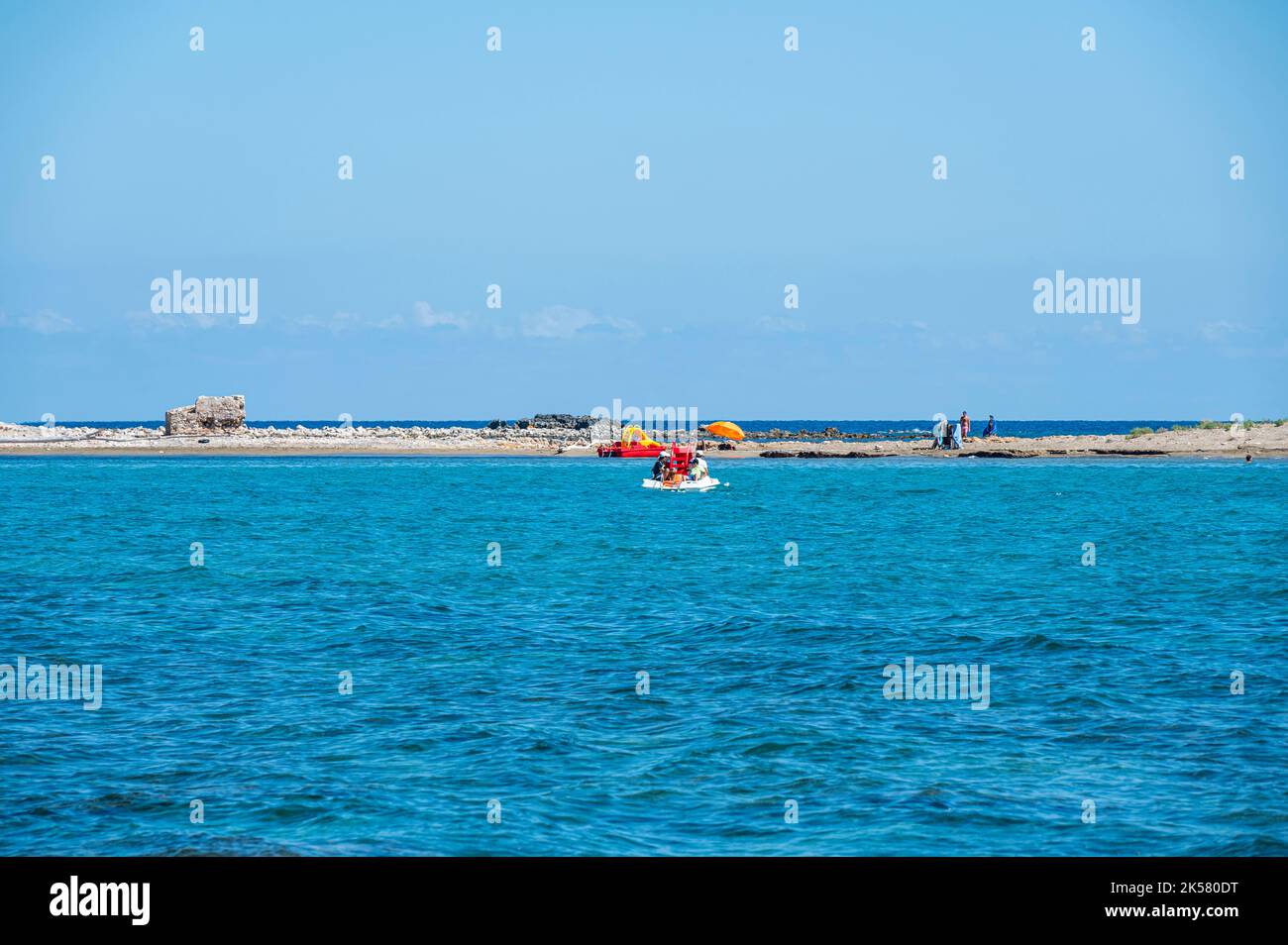 The island of Capo Passero in front of Portopalo where the waters of ...