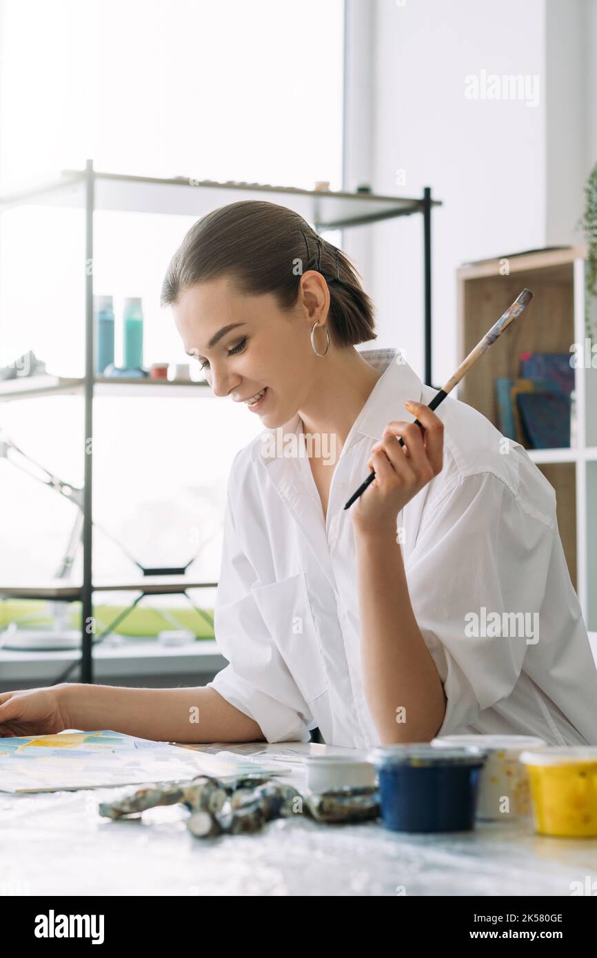 home art painting hobby inspired woman in studio Stock Photo - Alamy