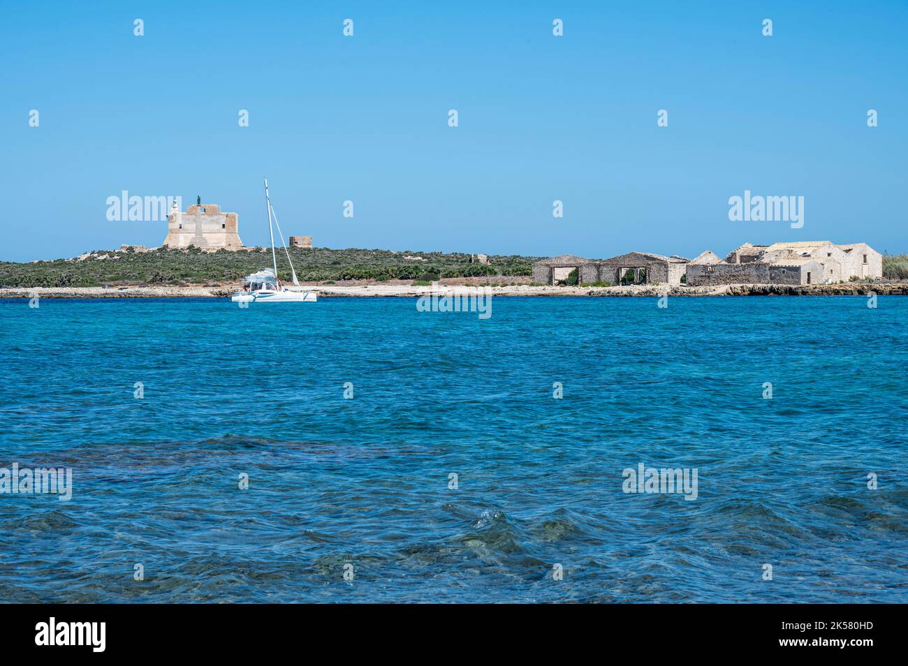 The island of Capo Passero in front of Portopalo where the waters of ...