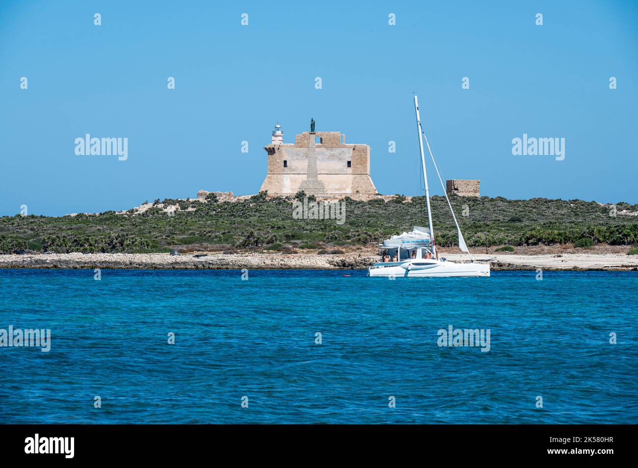 The island of Capo Passero in front of Portopalo where the waters of ...