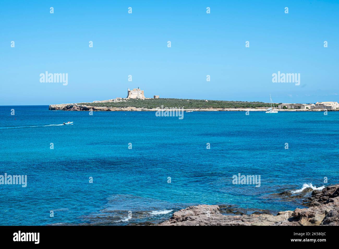 The island of Capo Passero in front of Portopalo where the waters of ...