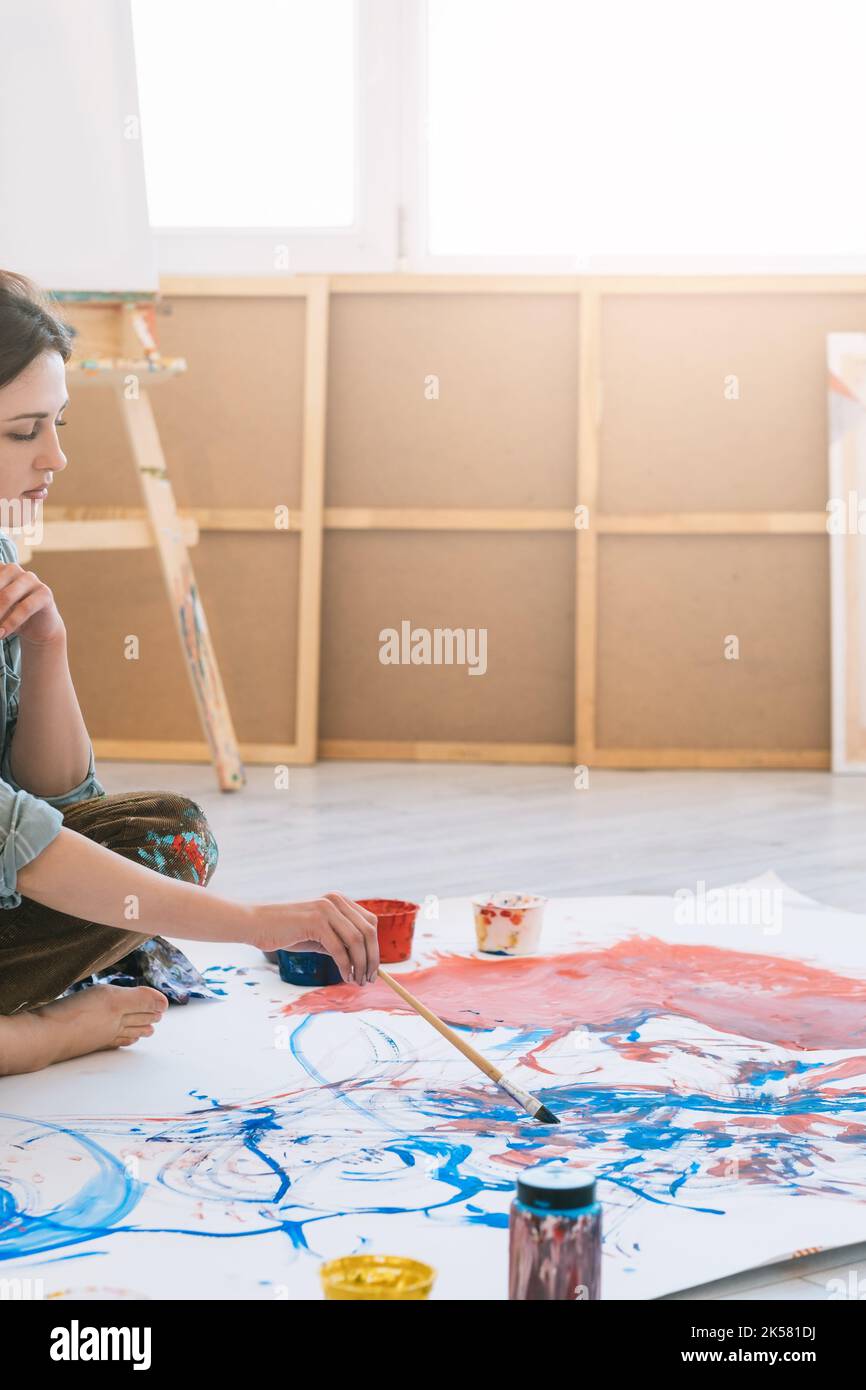 art therapy woman artist painting abstract artwork Stock Photo - Alamy