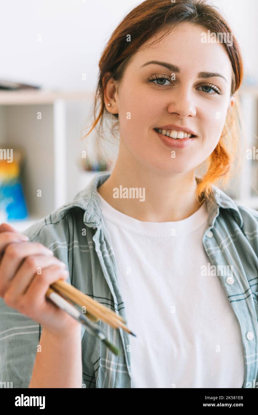 artist portrait painting hobby happy smiling woman Stock Photo - Alamy