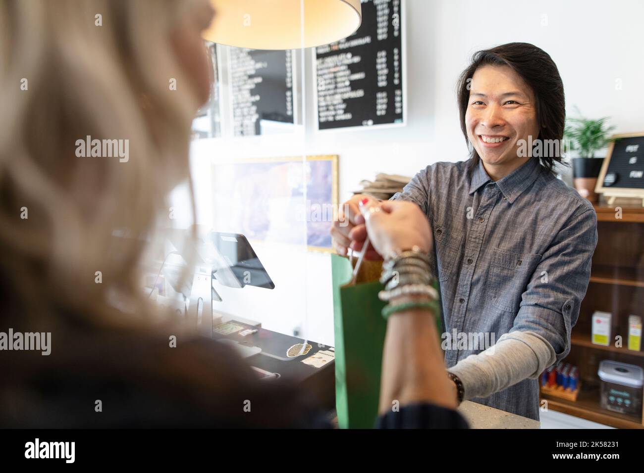 Over friendly worker hi-res stock photography and images - Alamy