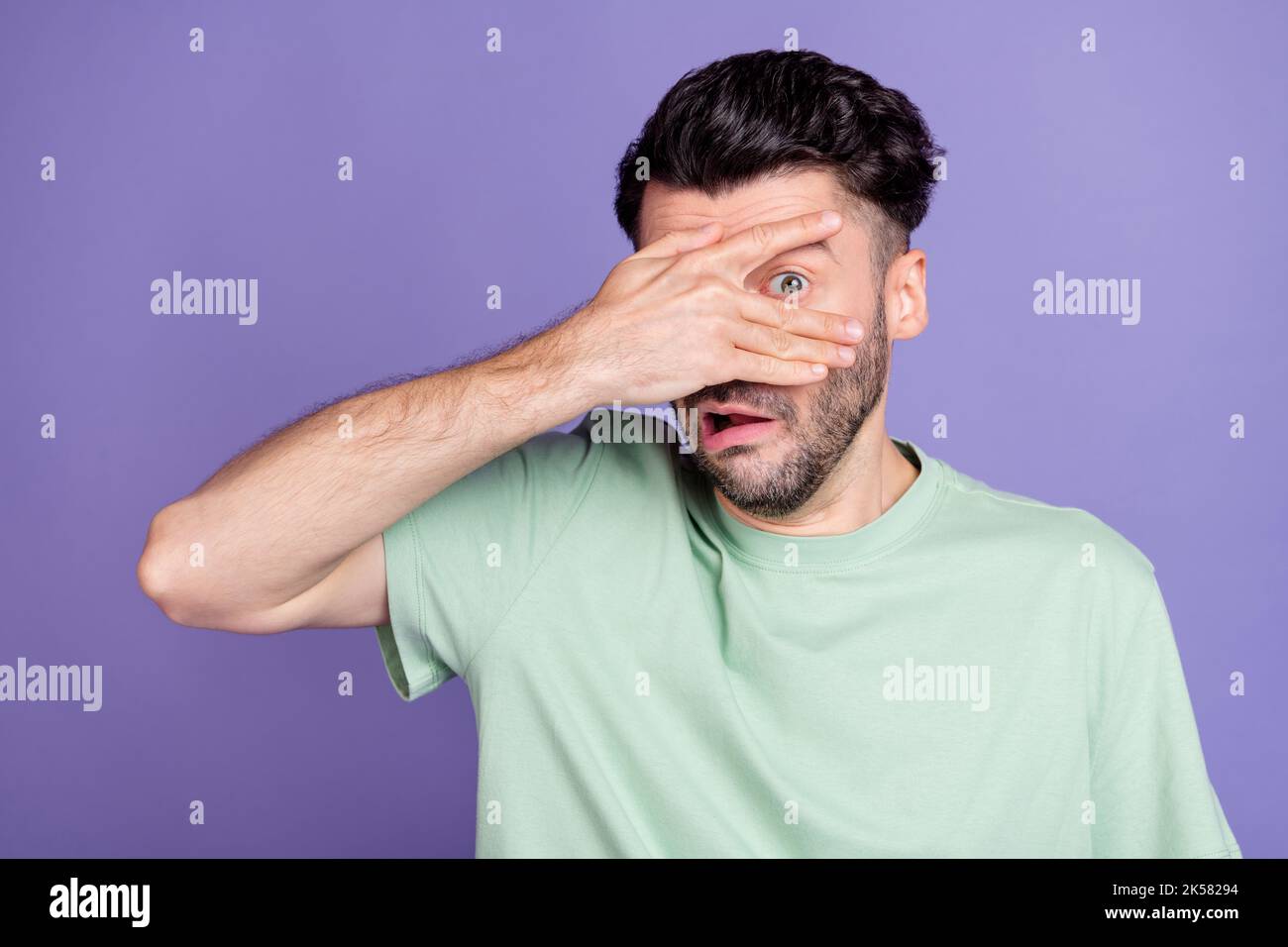 Portrait of scared stressed terrified man with brunet hairdo dressed t ...