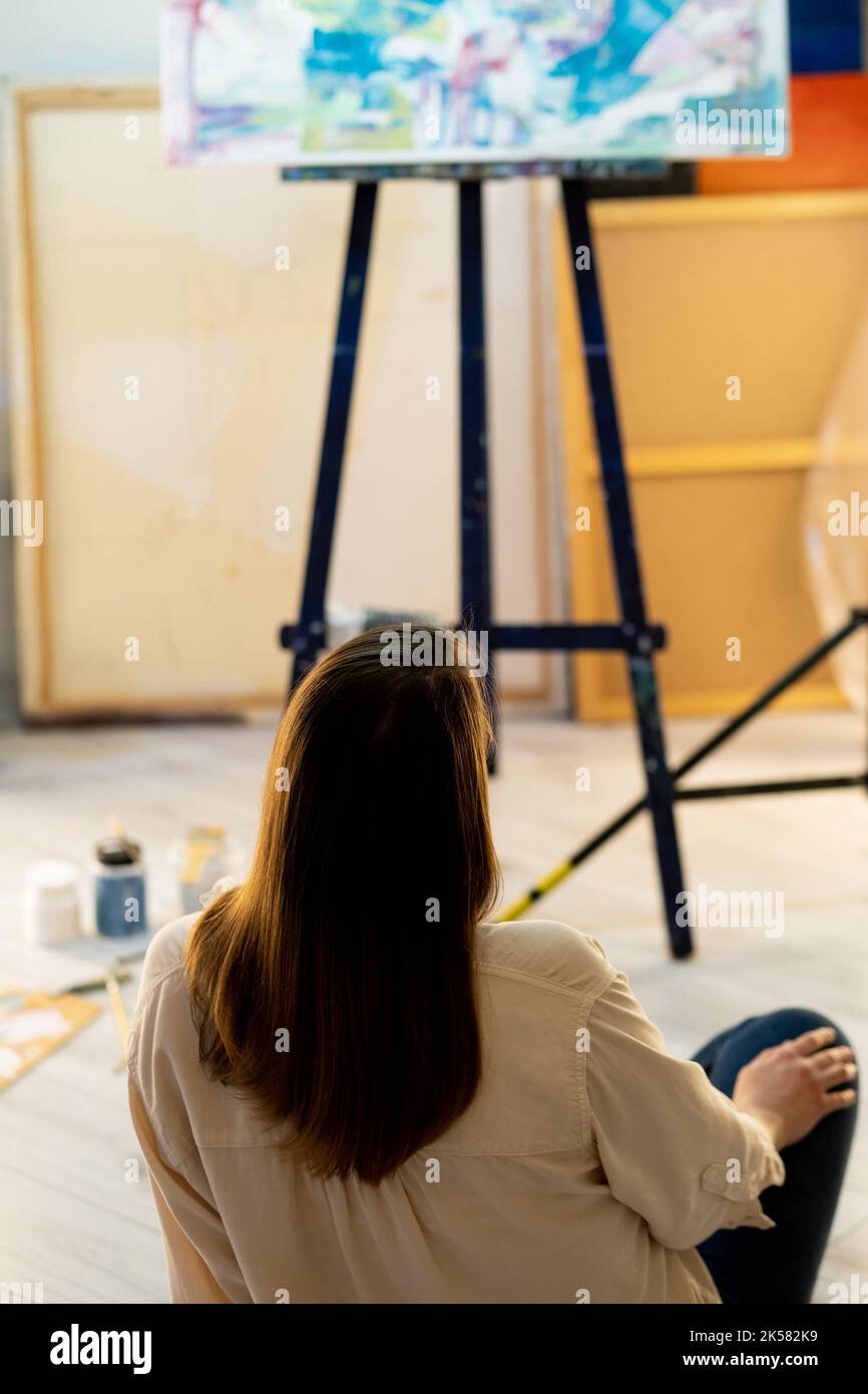 artistic woman enjoying masterpiece creating Stock Photo - Alamy