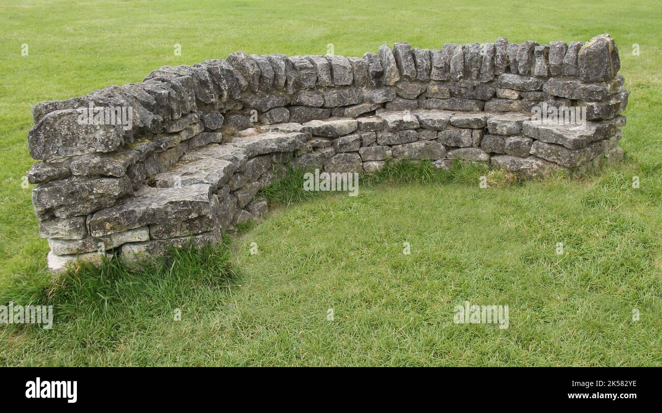 A Rustic Stone Park Bench Built From Local Rocks Stock Photo - Alamy