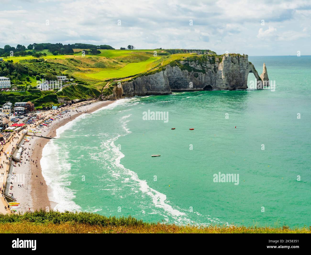 Famous view of Etretat coastline, green fields and vertical chalk ...