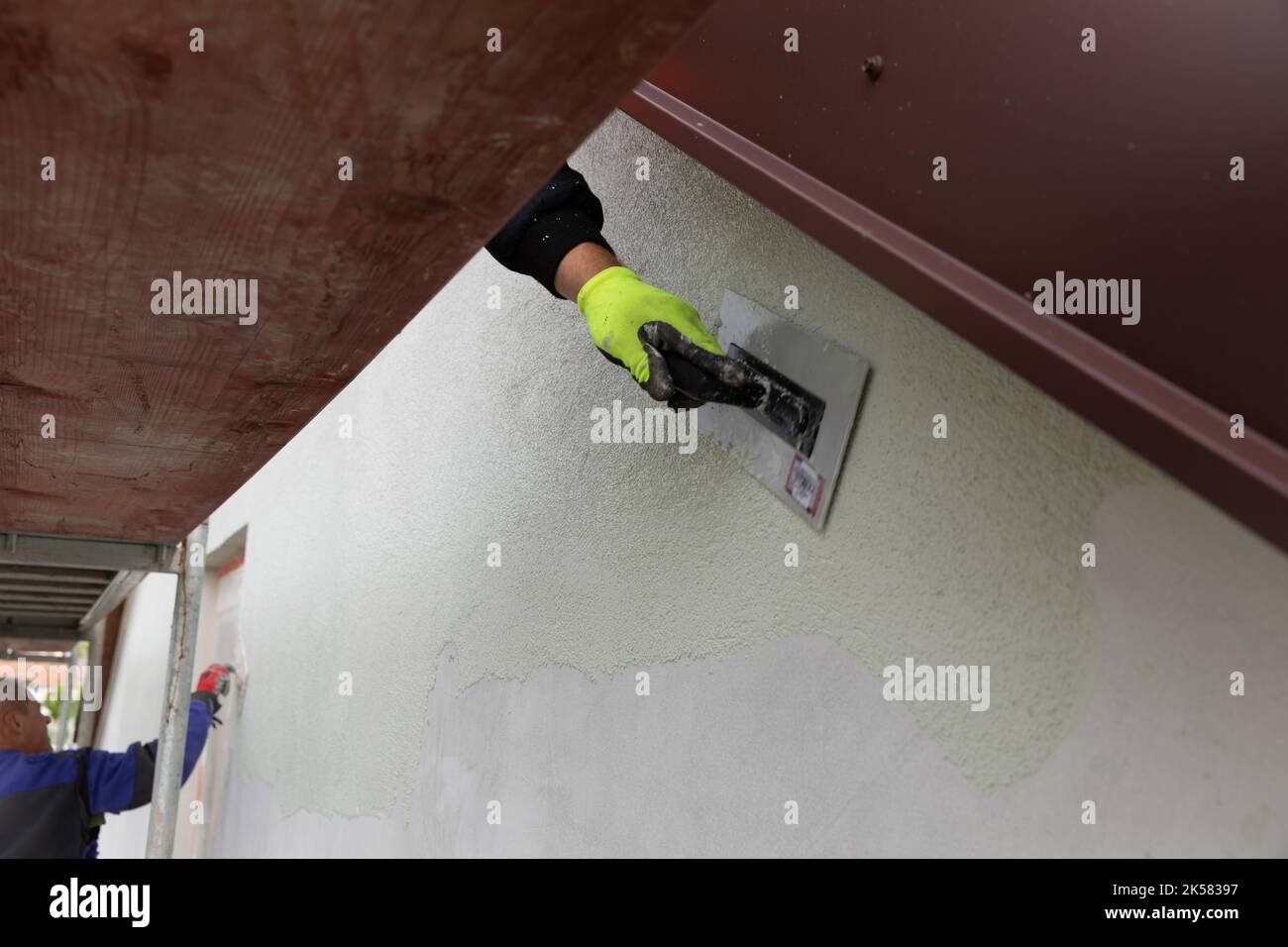Close-up of a worker's hand doing the finishing touches Stock Photo - Alamy