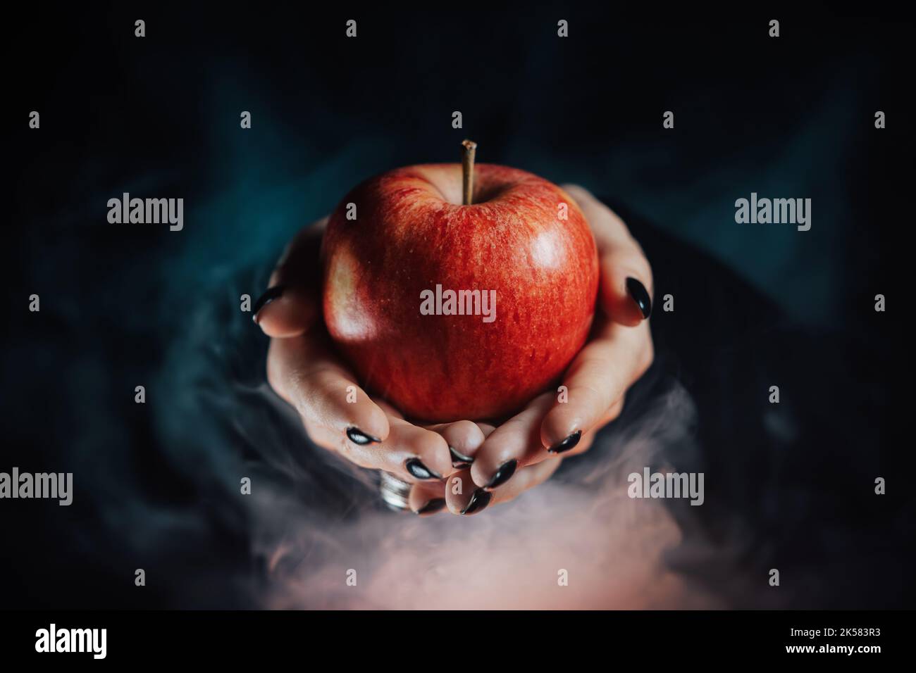 Woman as witch offers red apple - symbol of toxic proposal, lure ...