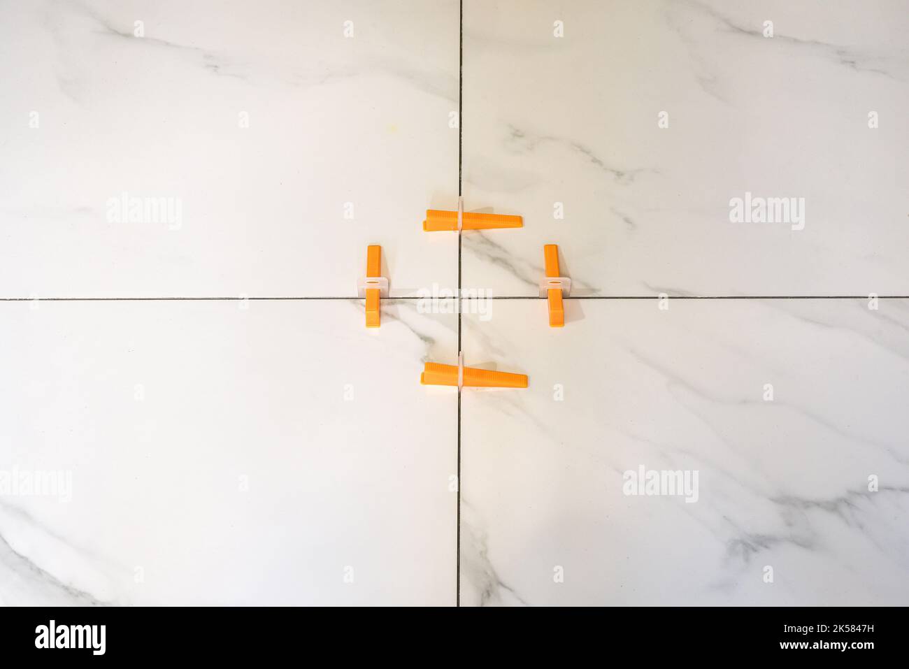 For use with marble, stone, and porcelain tile Levels, aligns, spaces ...