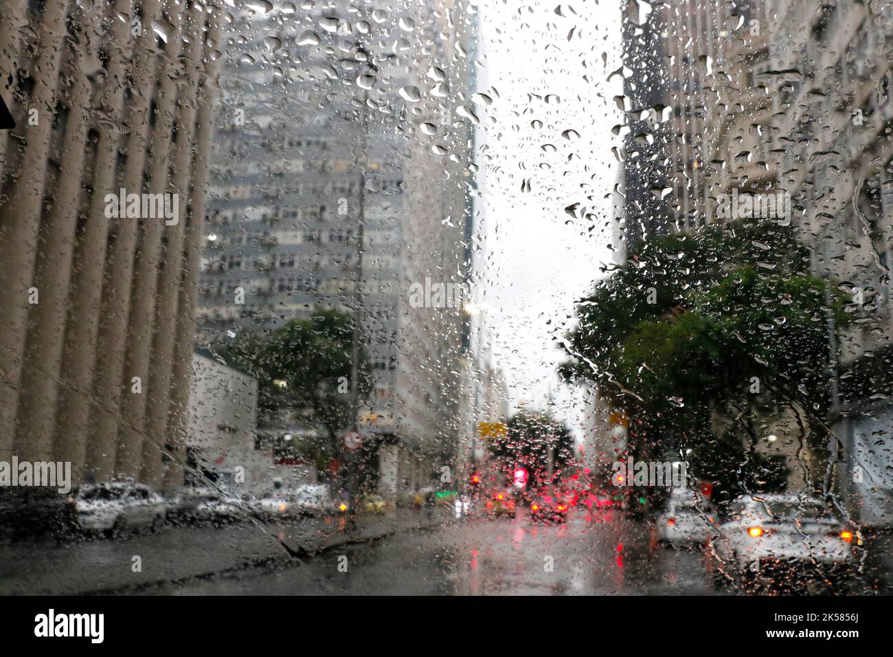 Rain drops on car window. Cold weather rainy season, cloudy wet day ...
