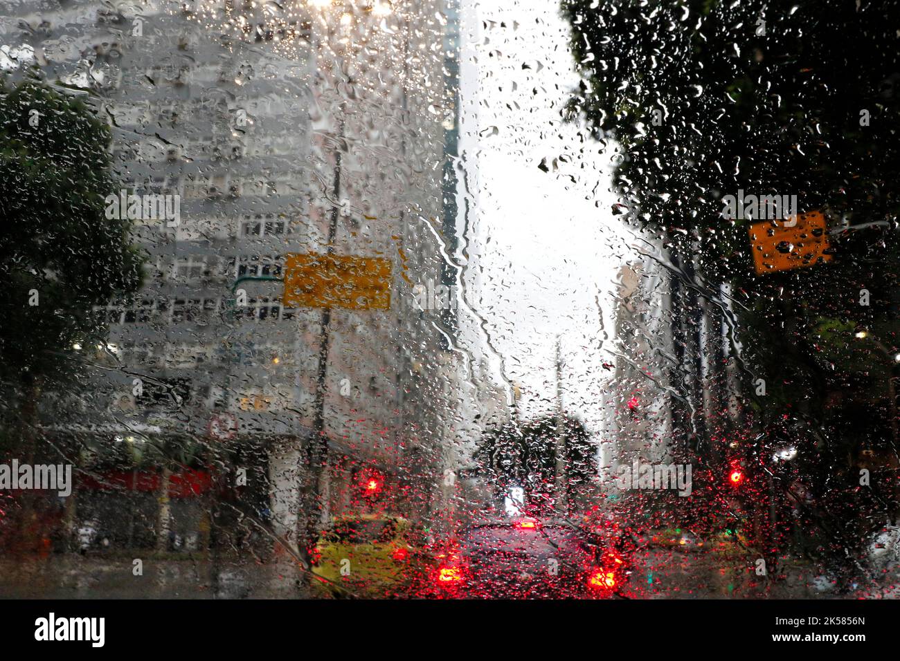 Rain drops on car window. Cold weather rainy season, cloudy wet day ...